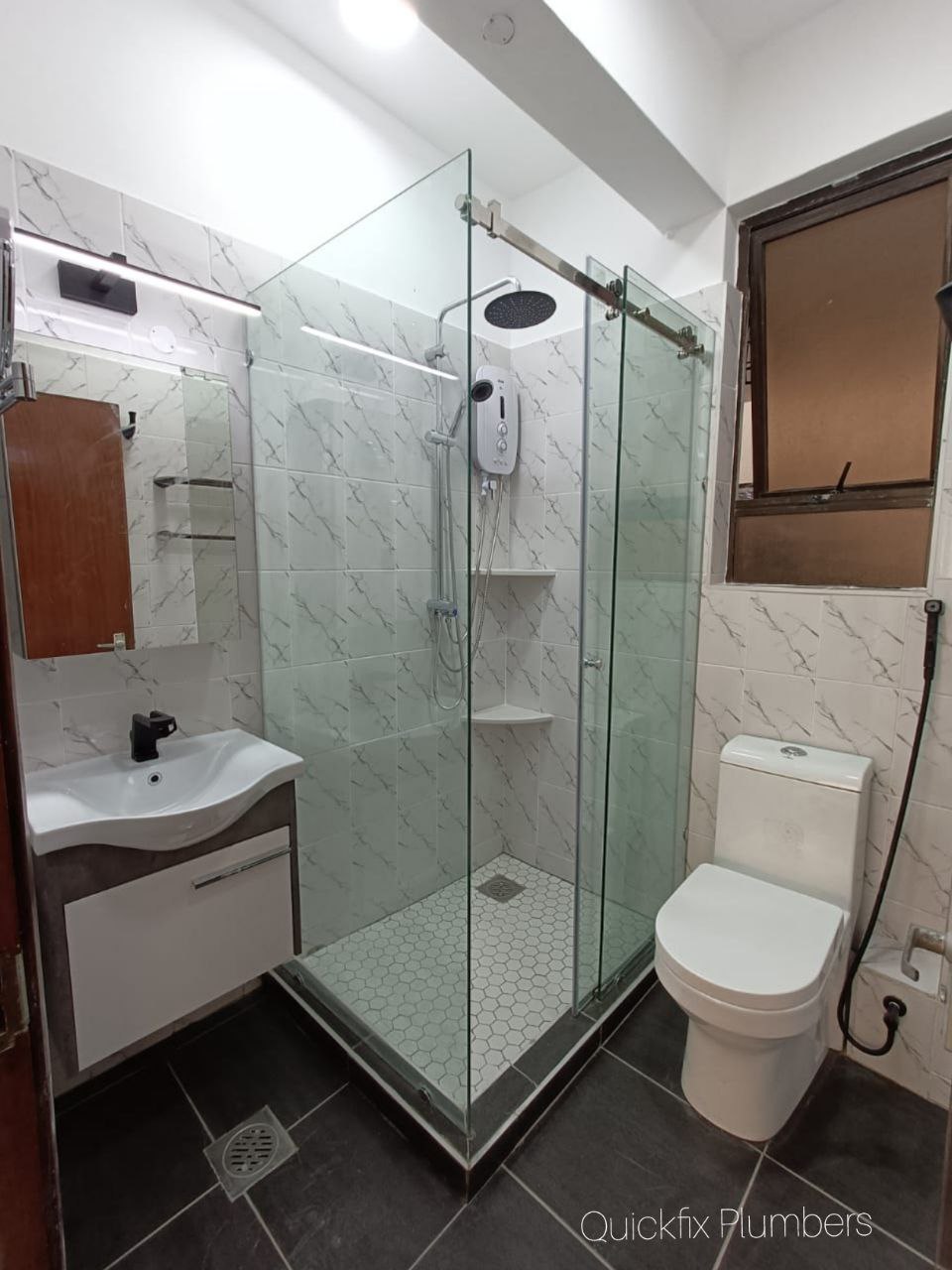 Quickfix Plumbers | Frameless Sliding shower cubicle